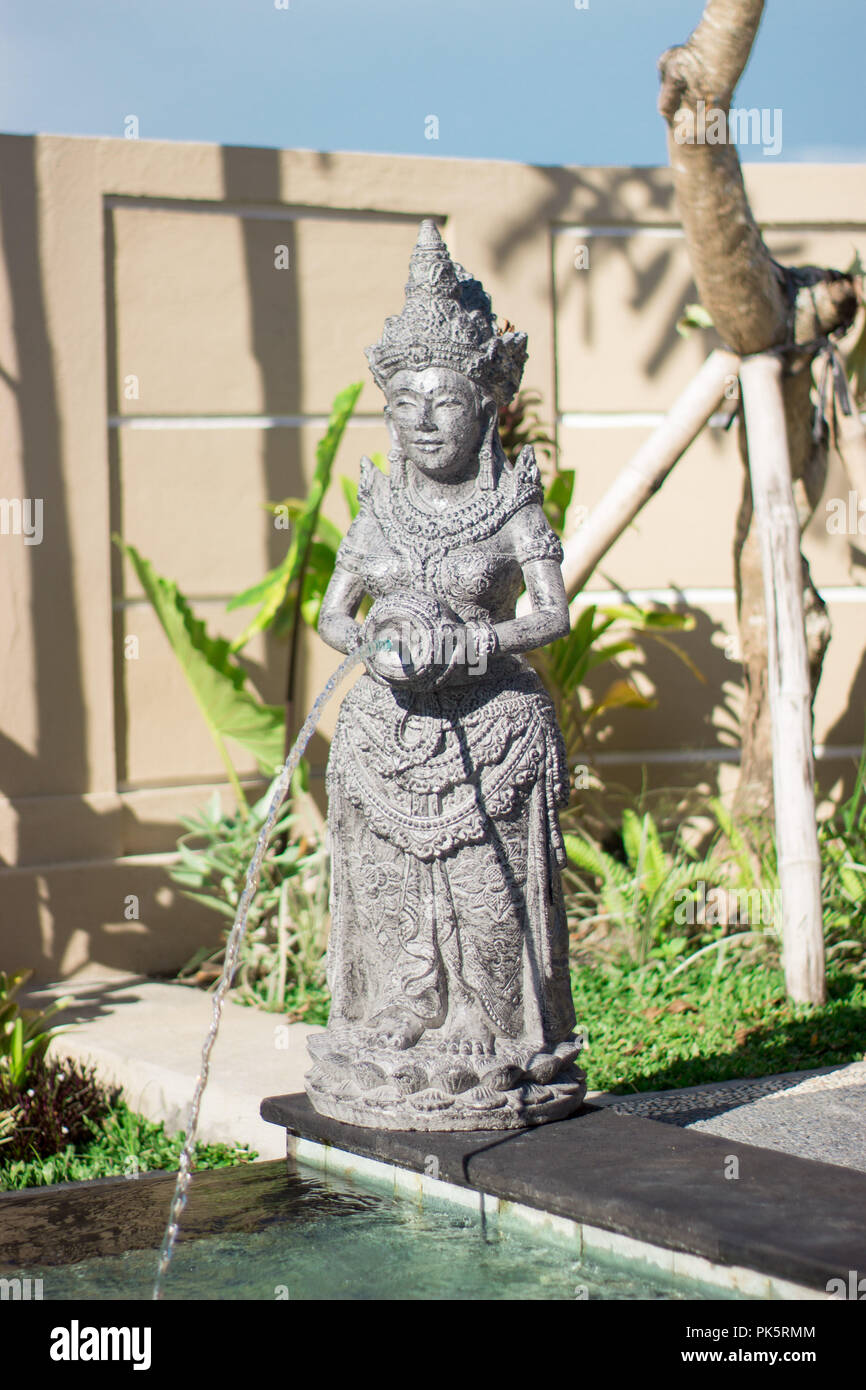 Beautiful fountain with statue of a woman with a water jug Stock Photo ...