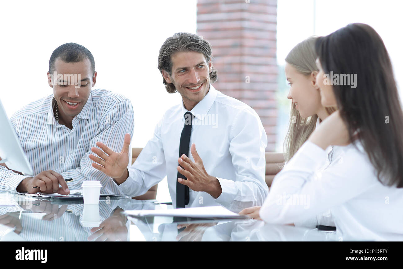 Manager holds a meeting with the business team Stock Photo - Alamy