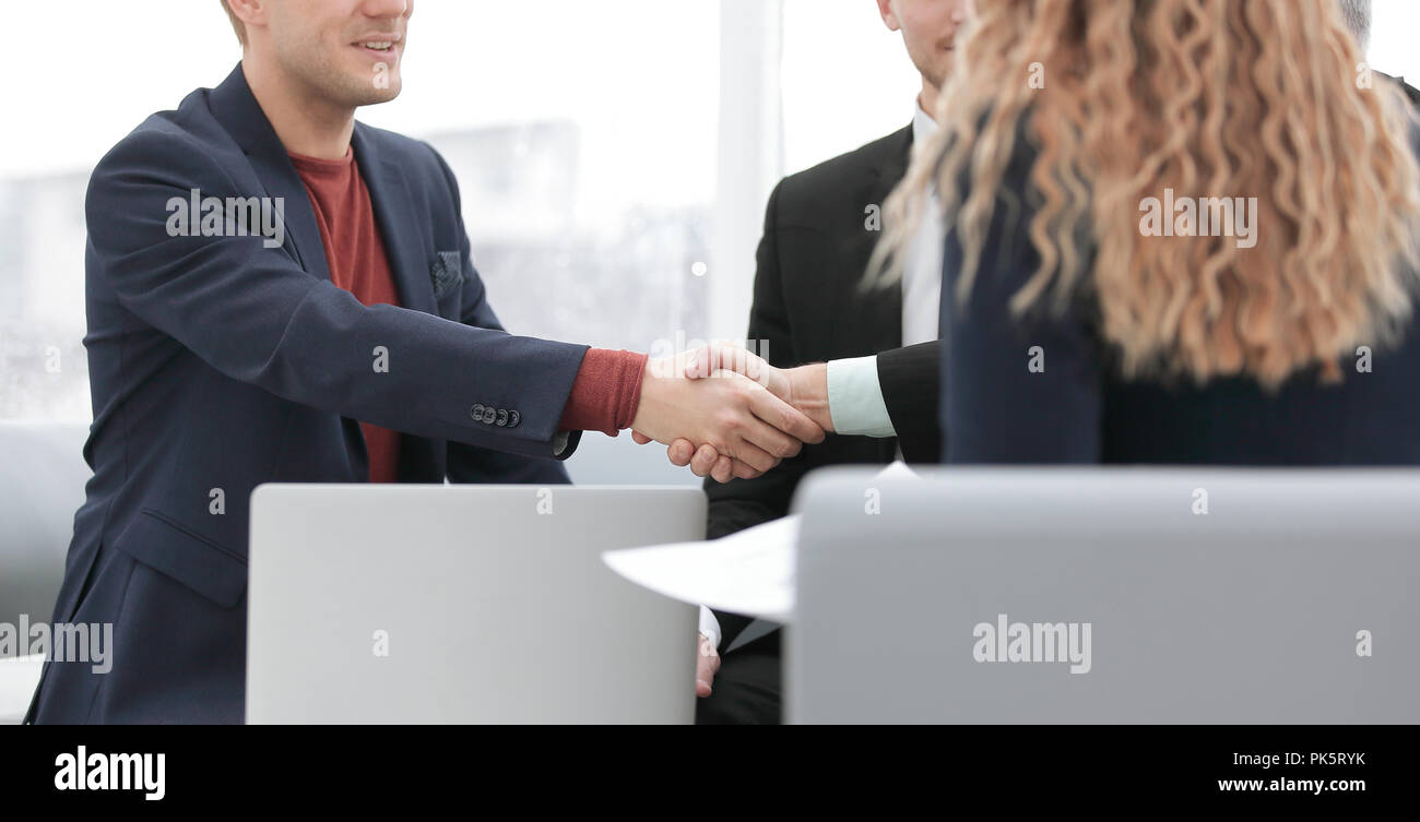 close up.handshake between Manager and client as a sign of cooperation ...