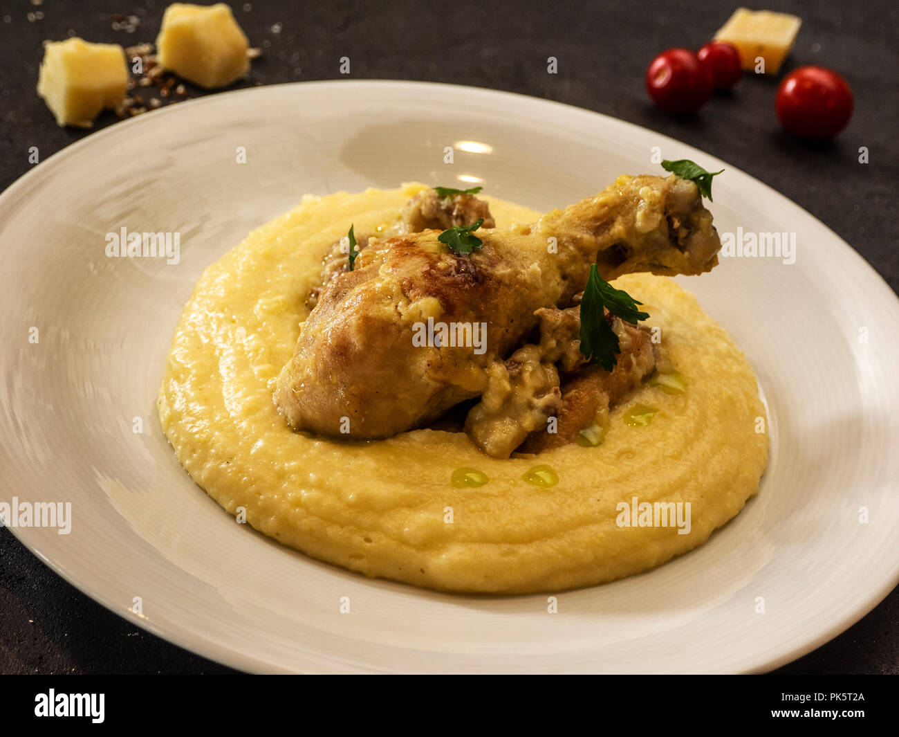 Chicken leg with cheese sauce Stock Photo - Alamy