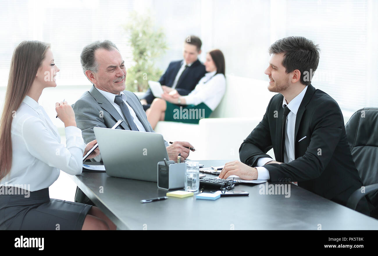 client talking with the staff at the Desk in the office Stock Photo - Alamy