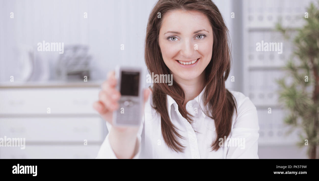 closeup. business woman showing a blank business card Stock Photo - Alamy