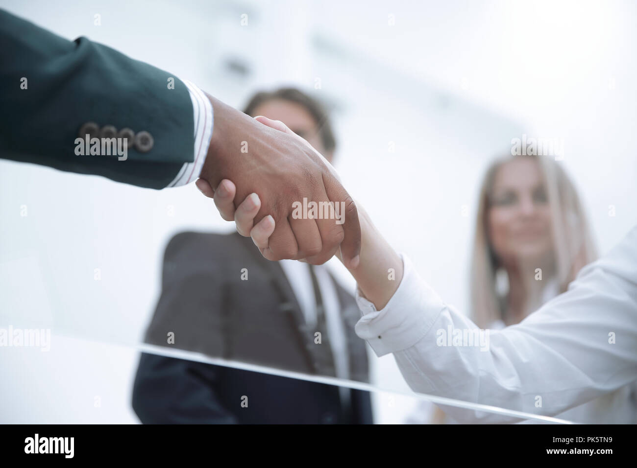 bottom view .handshake business women with a business partner Stock ...
