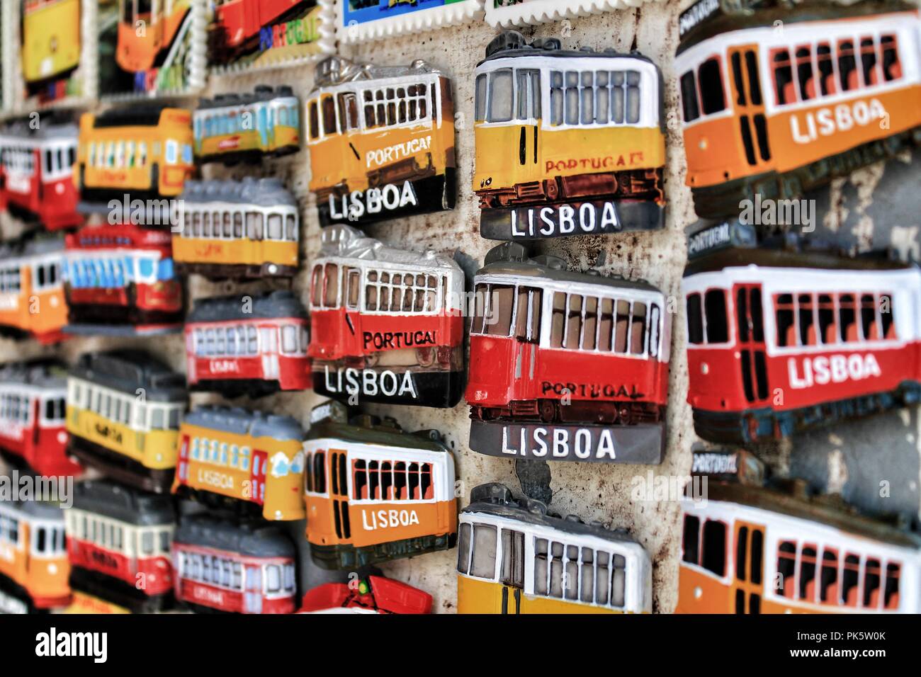 Colorful magnet tram souvenirs of Lisbon city. Word Lisbon written ...