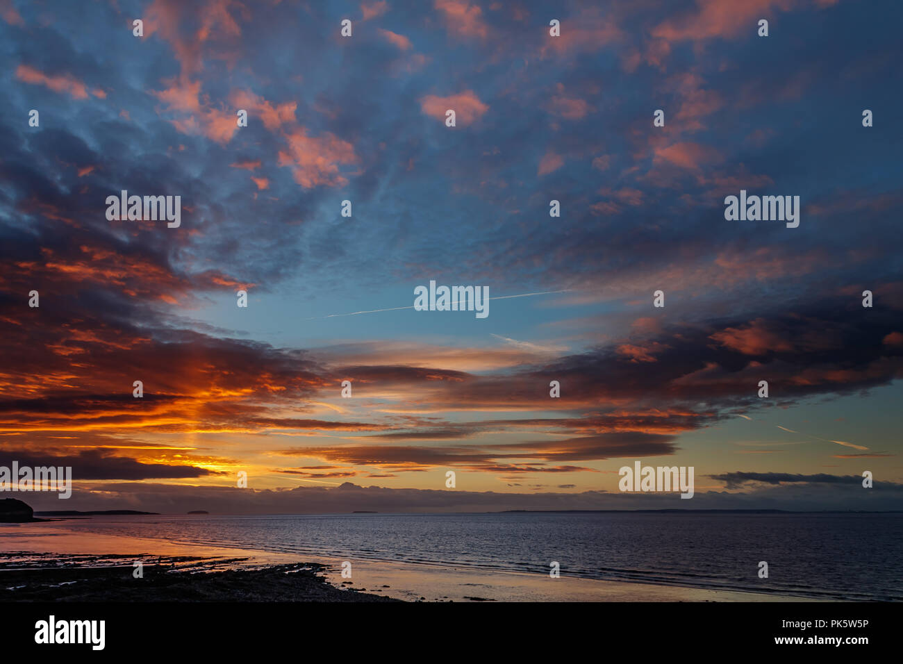 Blue sky at sunset Stock Photo - Alamy