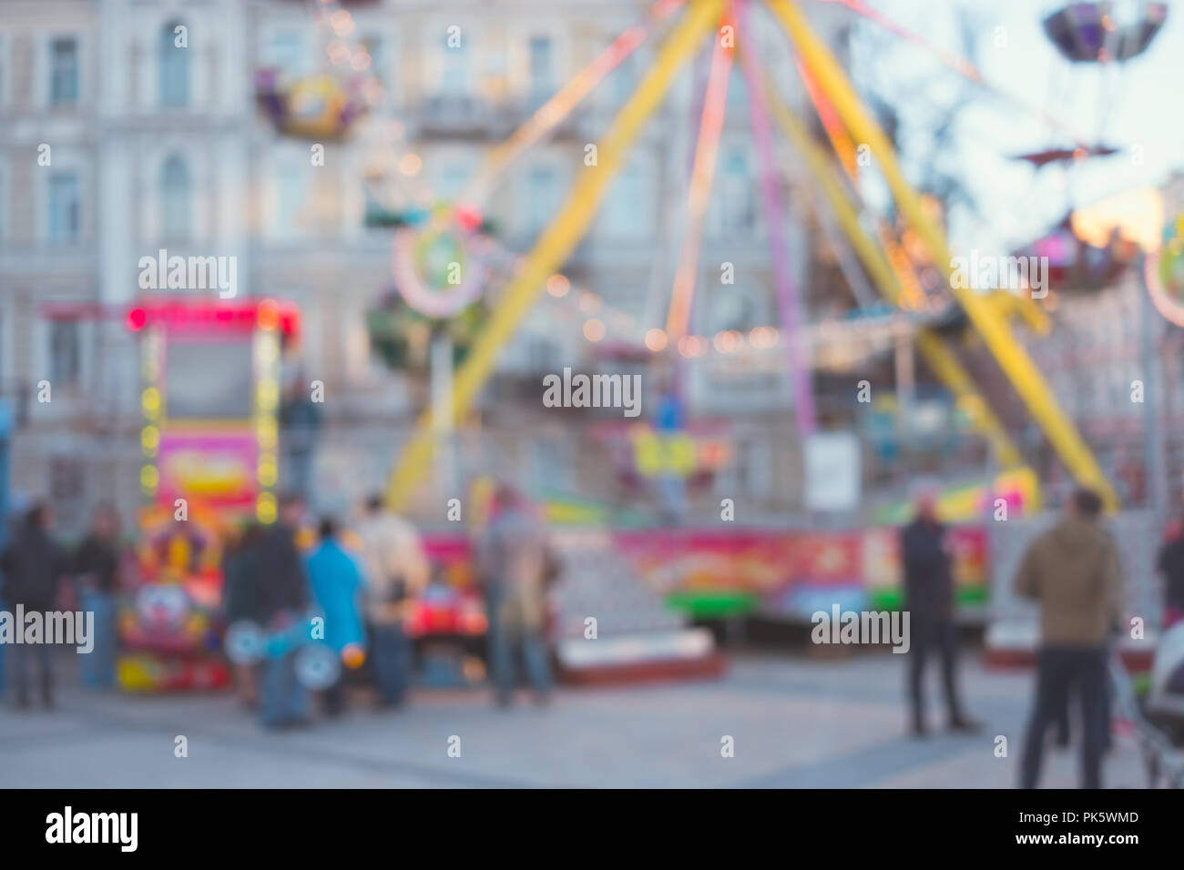 Image of blur street with festive lights and carousel in night time ...