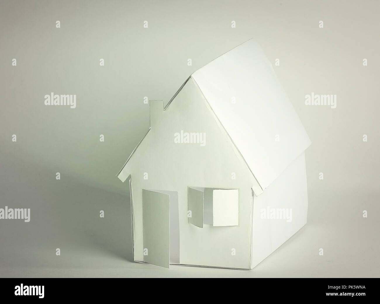paper house paper background.the concept of a mortgage Stock Photo - Alamy