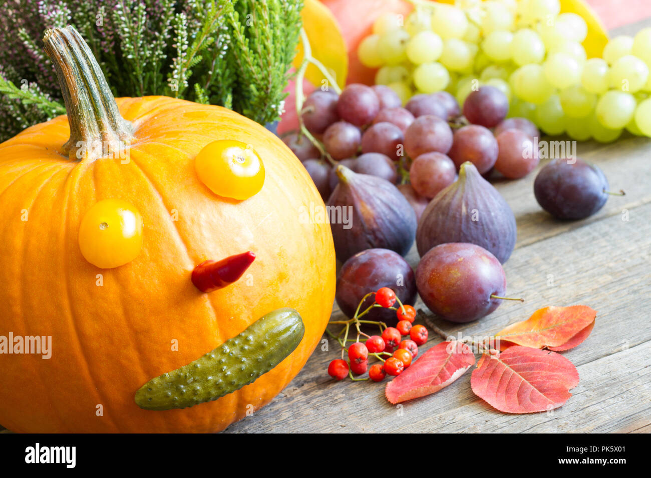Autumn pumpkin fun background with colorful leaves and fruits and ...