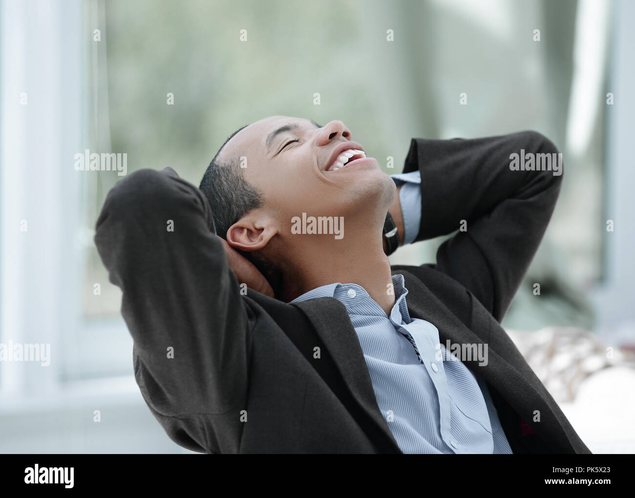 dreaming of a businessman sitting at his Desk Stock Photo - Alamy