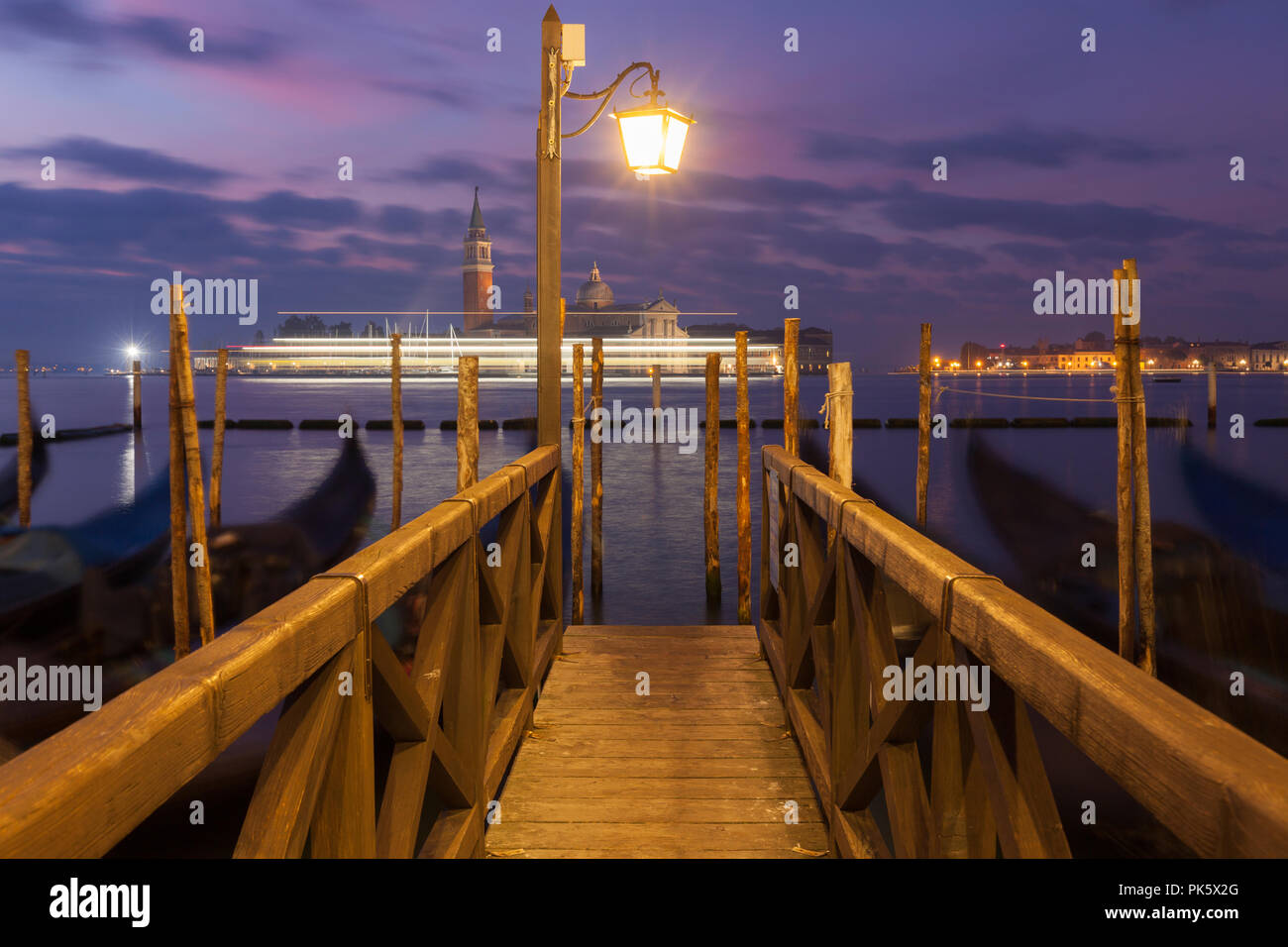 Venice classic sunrise view with gondolas on the waves. Venice, Italy ...