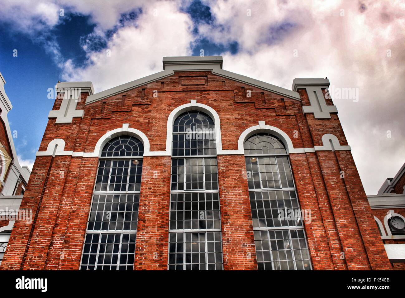 Facade of the electricity museum building in Lisbon under cloudy sky ...