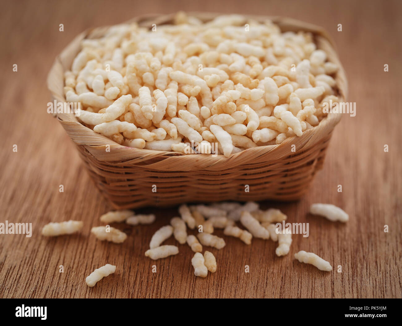 Fresh puffed rice in a basket on natural surface Stock Photo - Alamy