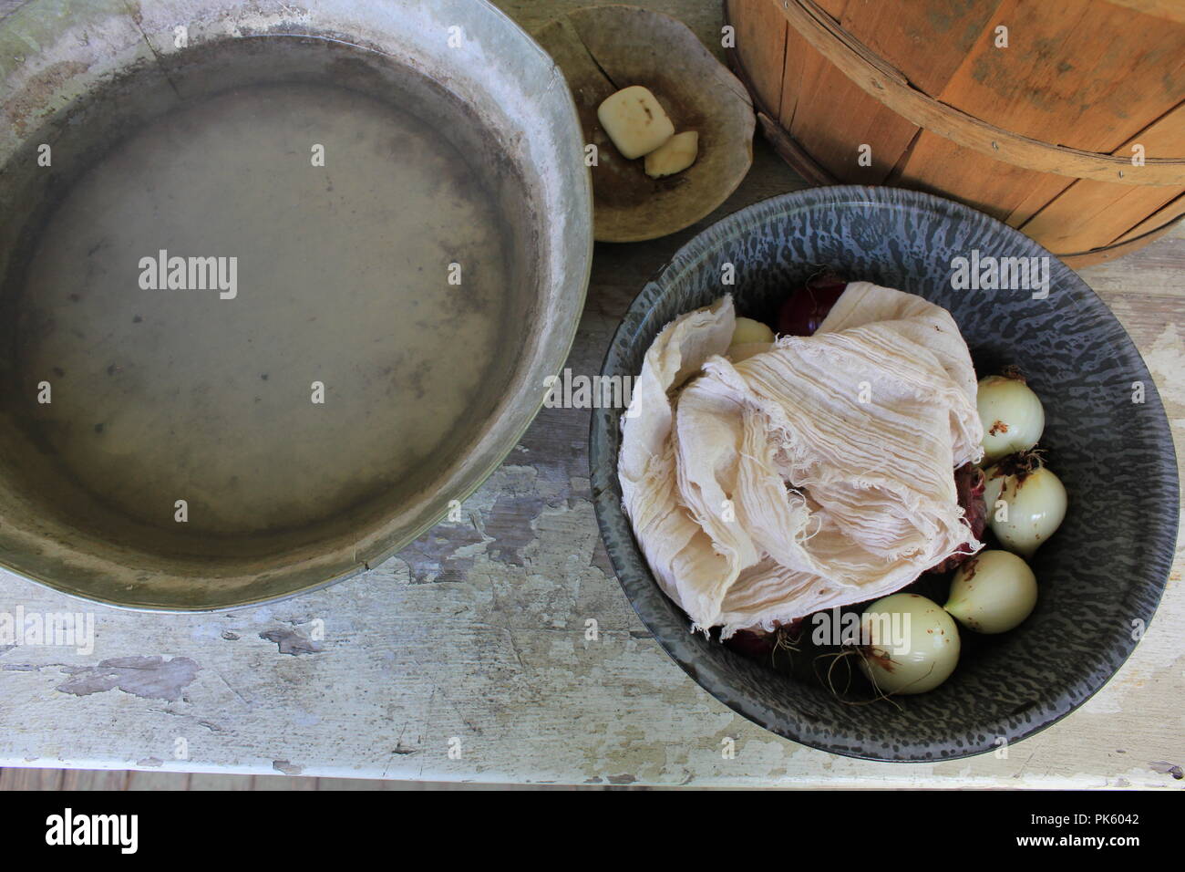 Hand washing onions at the kitchen table on a late summer day Stock ...