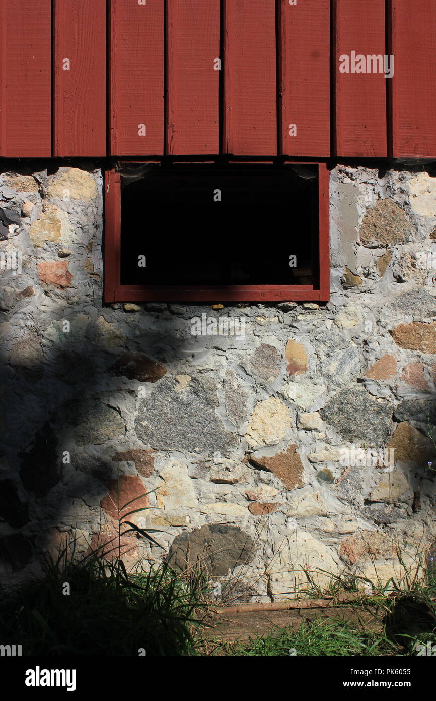 Cow barn window and rock wall on a late summer day Stock Photo - Alamy