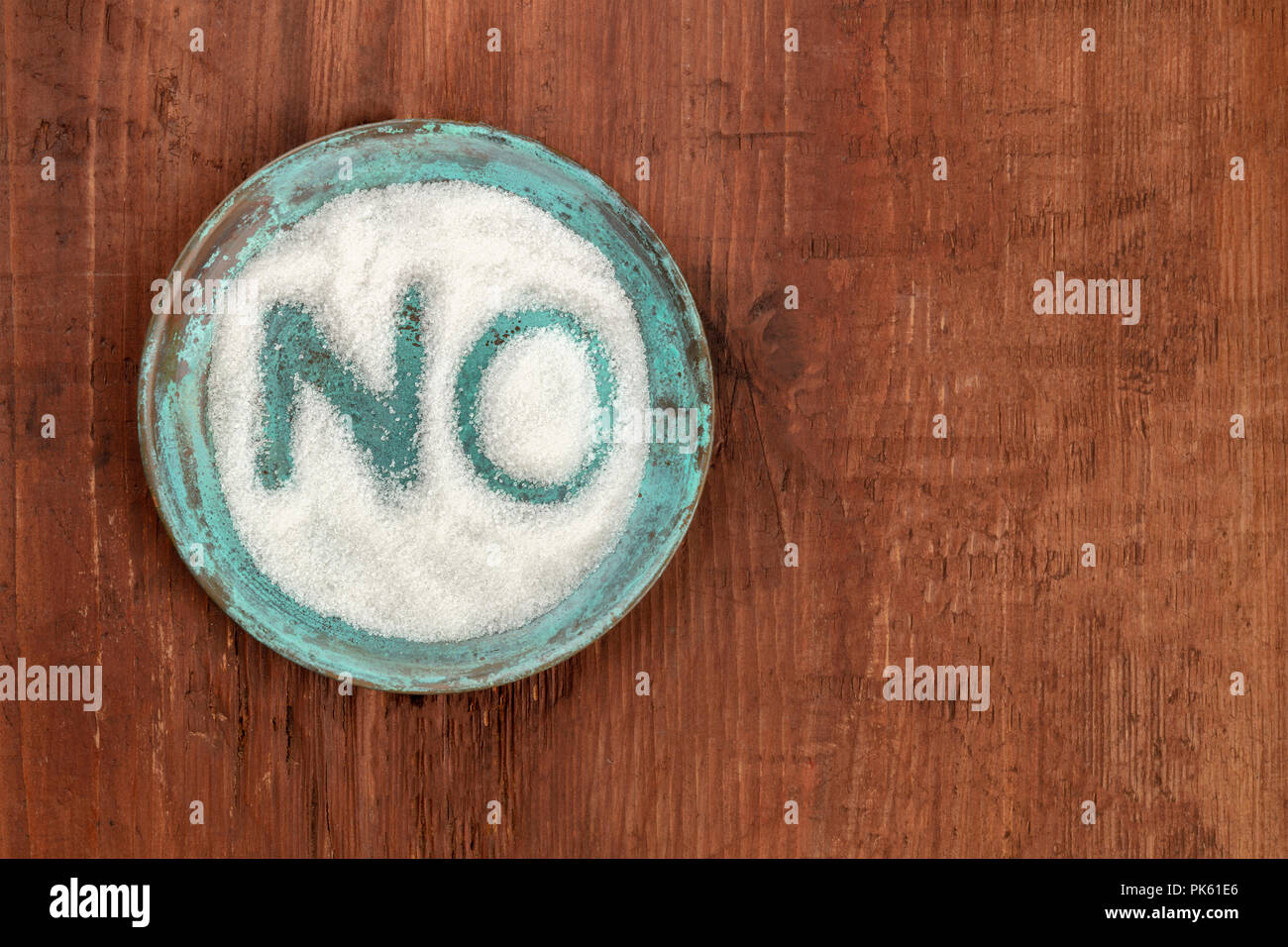 No sugar concept, the word drawn on a plate with sugar, shot from above ...