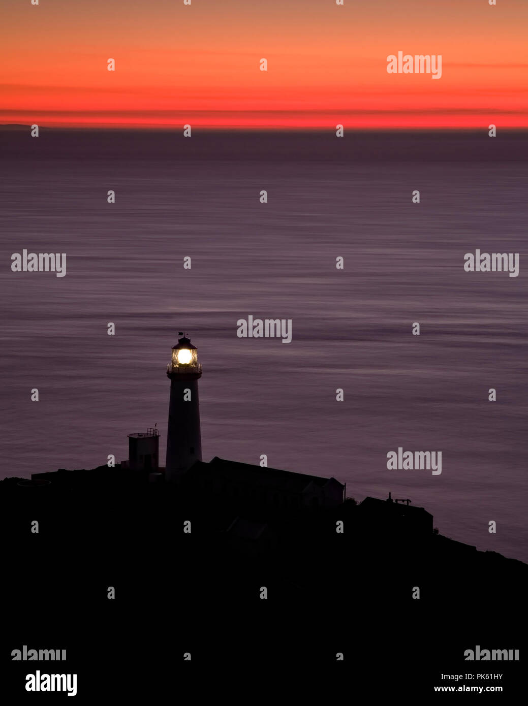 South Stack lighthouse at sunset on the coast of Anglesey, North Wales ...