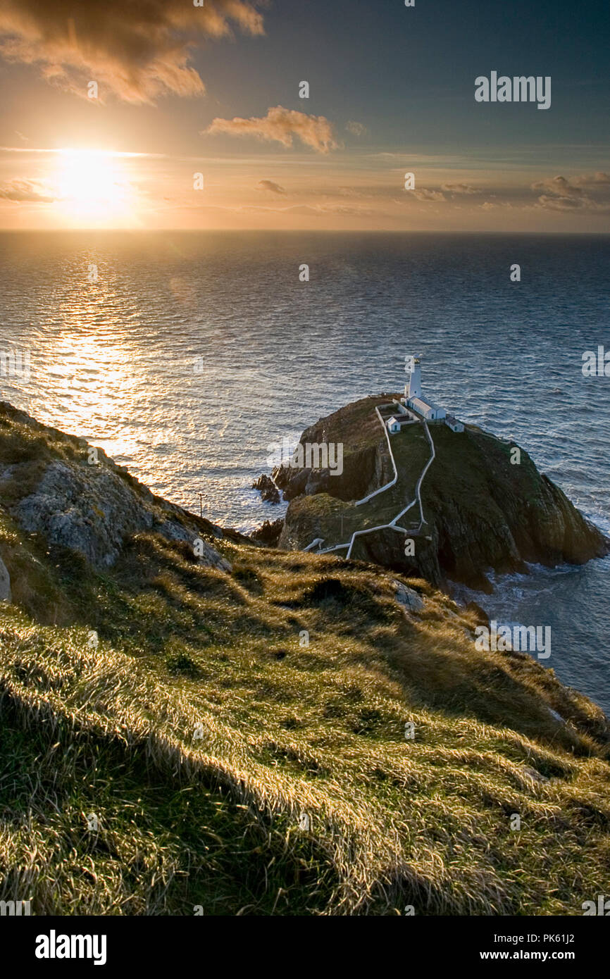 Lighthouse waves sun wales hi-res stock photography and images - Alamy
