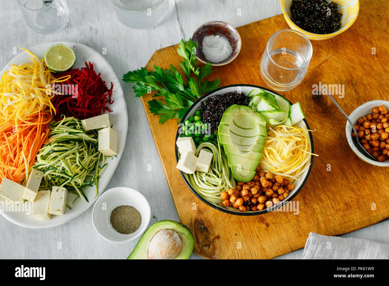 Top view bowl of buddha with spiralized vegetables on white wooden ...