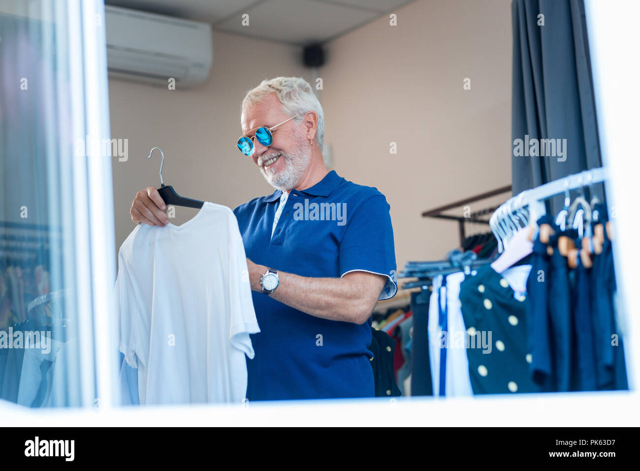 Cheerful grey haired man being satisfied with shopping Stock Photo - Alamy