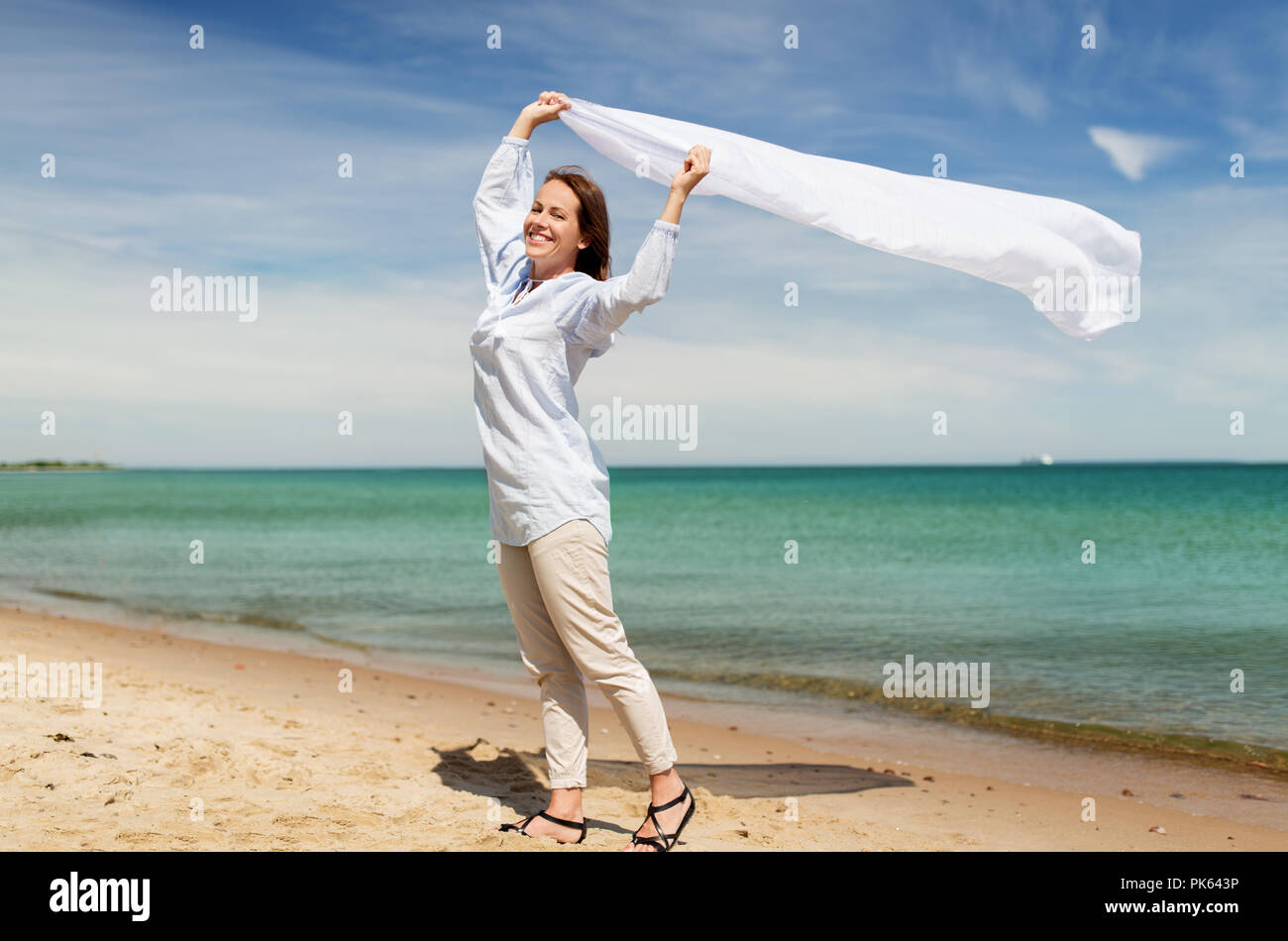 People waving on beach hi-res stock photography and images - Alamy