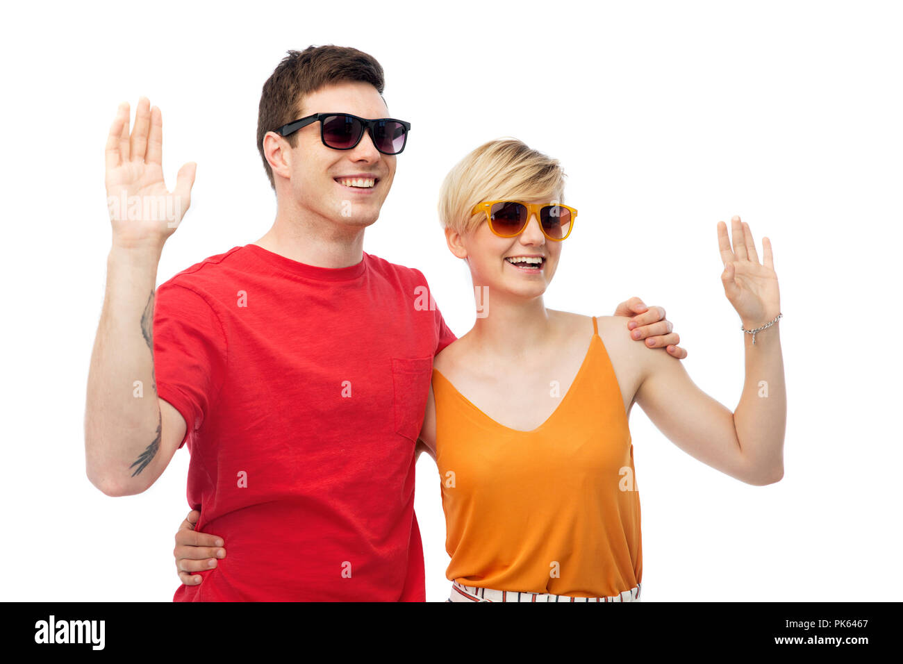 couple in sunglasses hugging and waving hands Stock Photo - Alamy