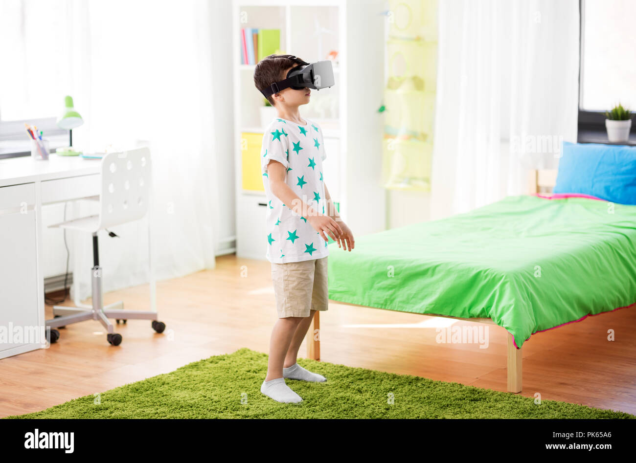 boy in virtual reality headset playing at home Stock Photo - Alamy