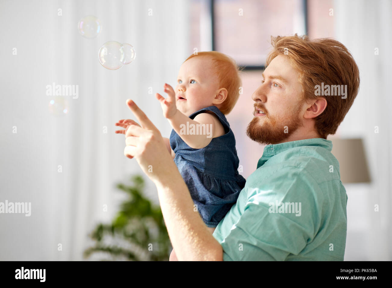 Child holding soap bubble hi-res stock photography and images - Alamy