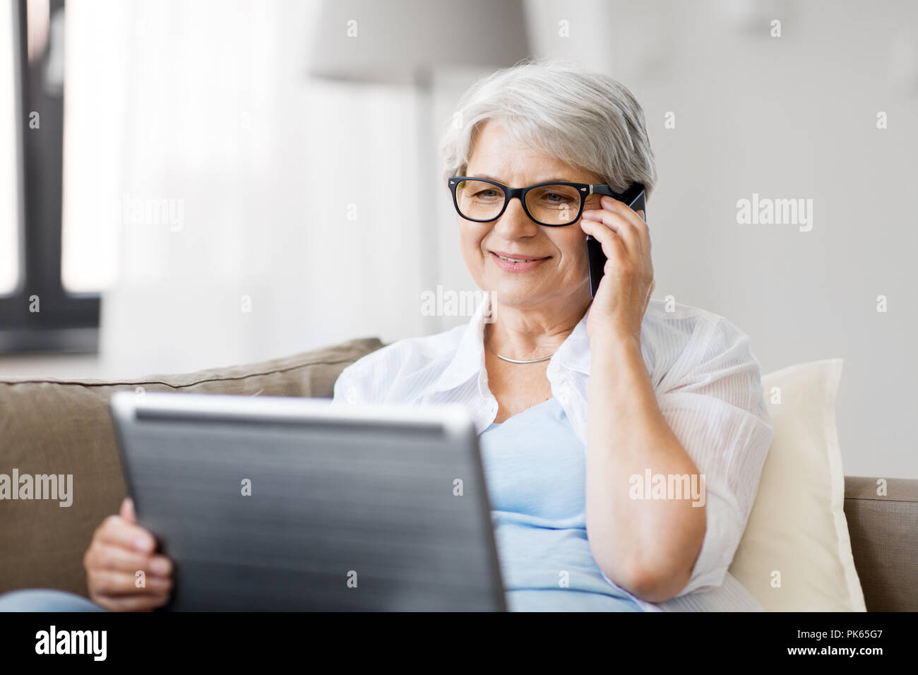 Senior woman laptop calling hi-res stock photography and images - Alamy