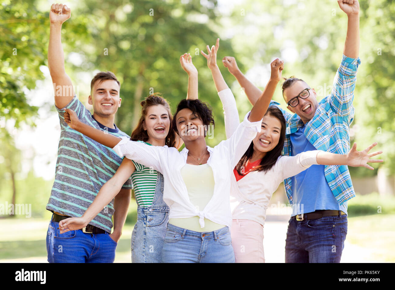 group of happy smiling friends having fun outdoors Stock Photo - Alamy