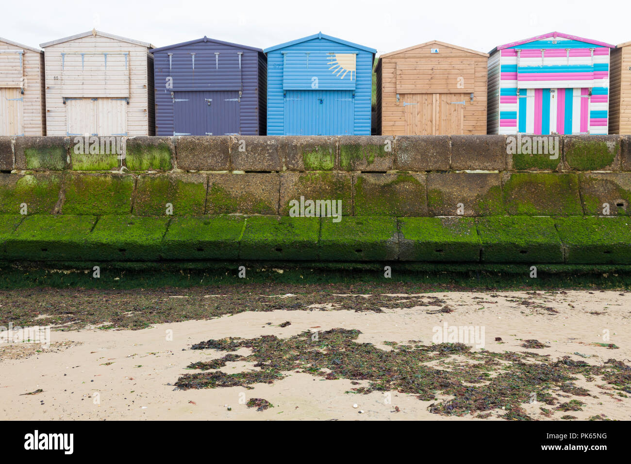 Beach huts on a seaside promenade Stock Photo - Alamy