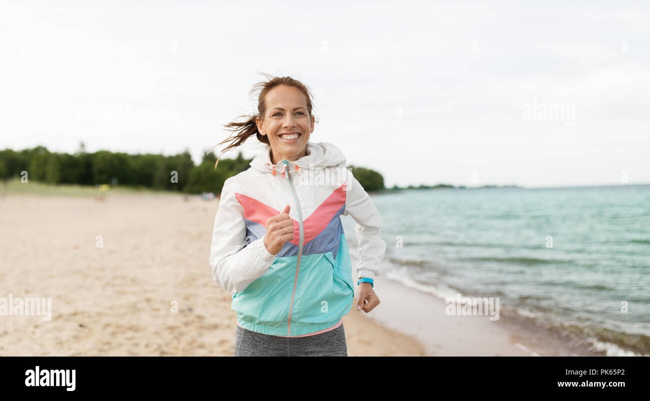 Woman fitness beach happy hi-res stock photography and images - Alamy