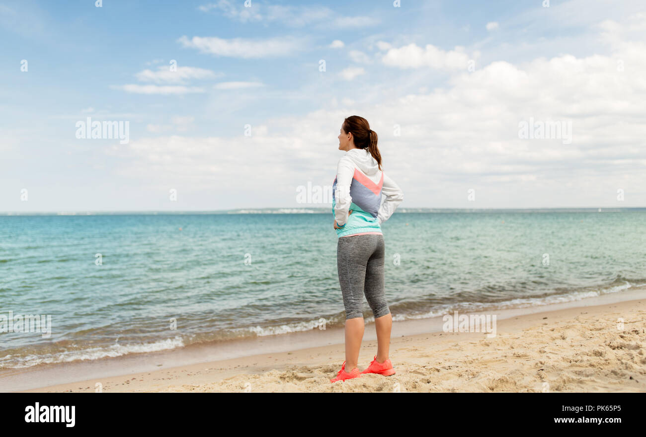 Woman exercising in beach on hi-res stock photography and images - Alamy