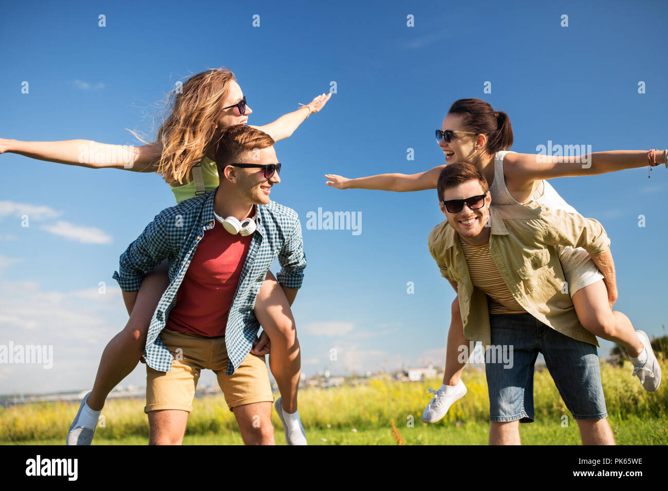 summer holidays and teenage concept - group of teenagers showing thumbs ...