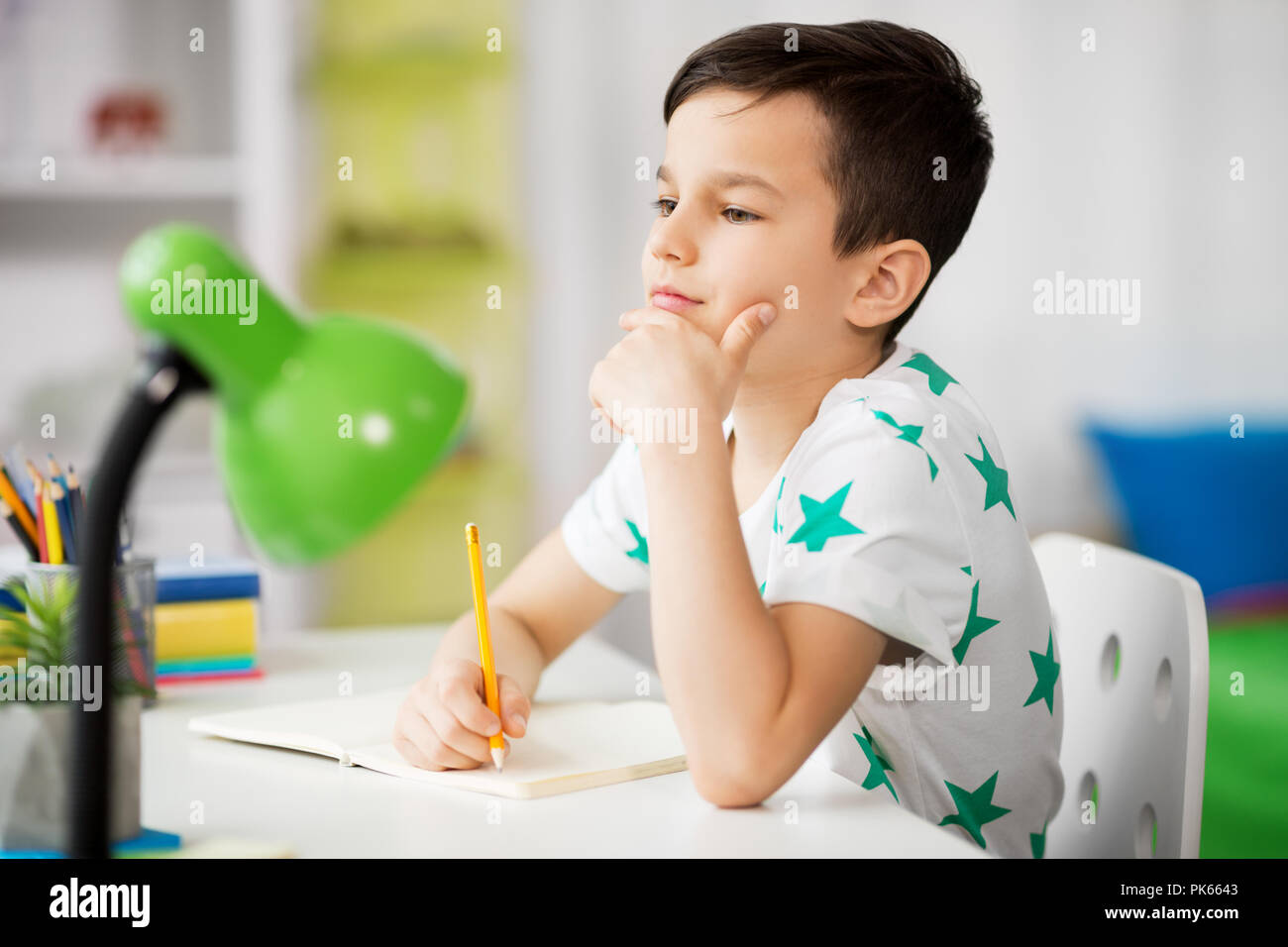 Teen boy writing hi-res stock photography and images - Alamy