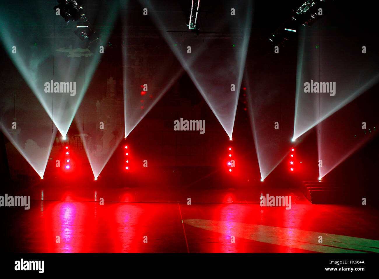 Red and white spotlights on a stage Stock Photo - Alamy