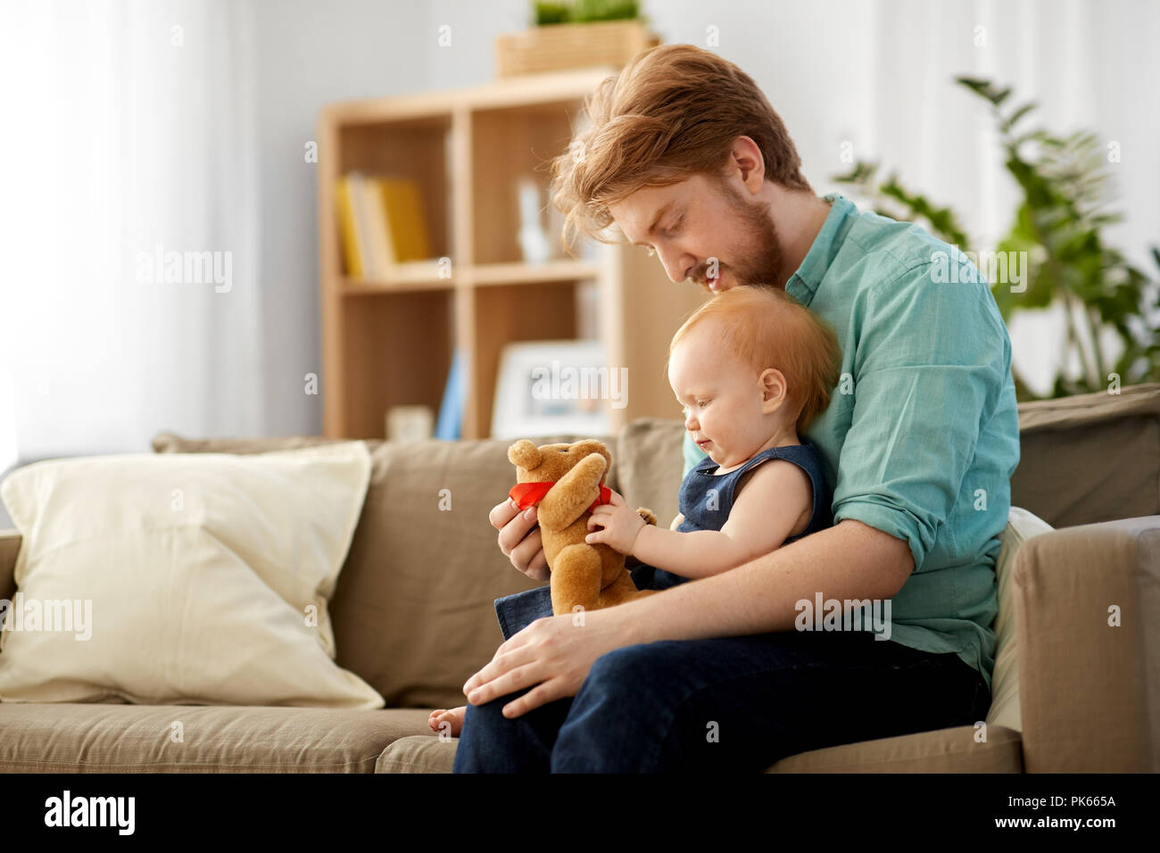 father and baby daughter with teddy bear at home Stock Photo - Alamy