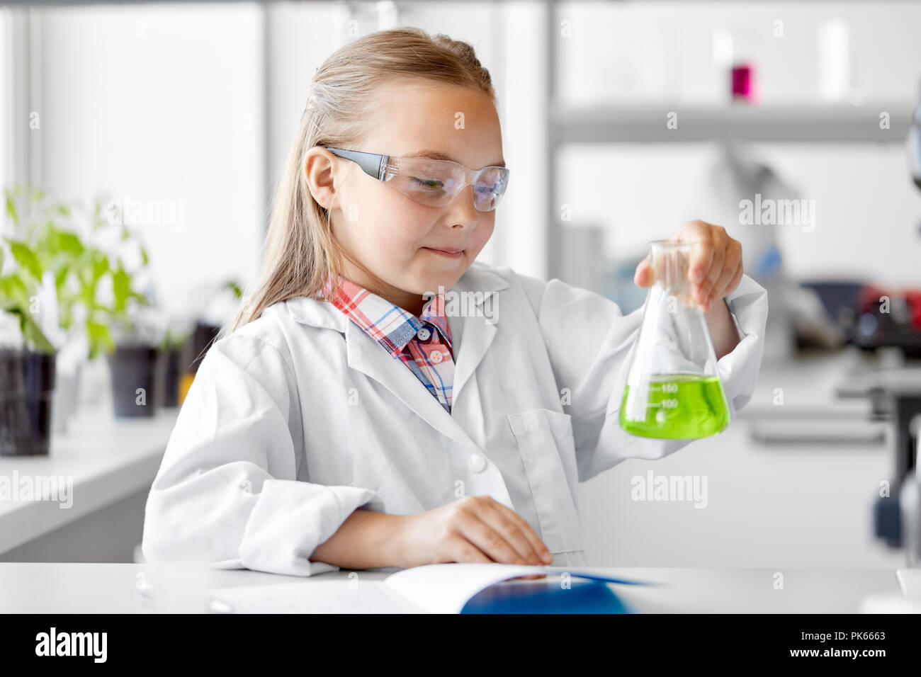 girl with test tube studying chemistry at school Stock Photo - Alamy
