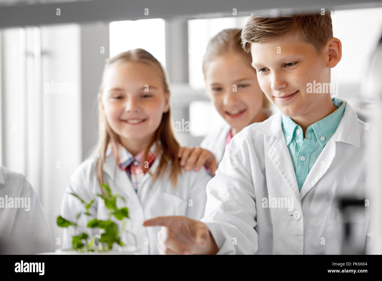 kids or students with plant at biology class Stock Photo - Alamy