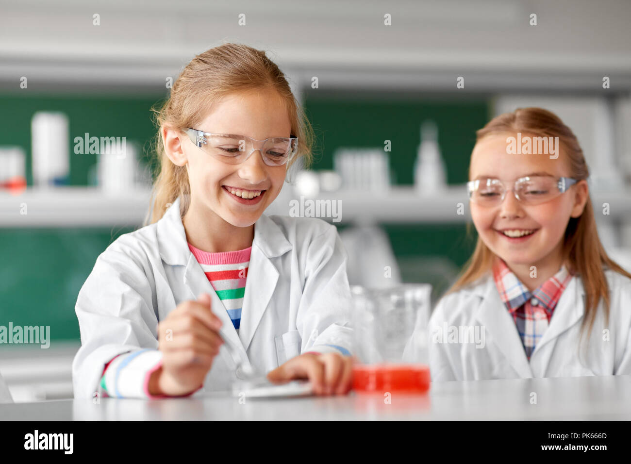 kids making chemical experiment at school lab Stock Photo - Alamy