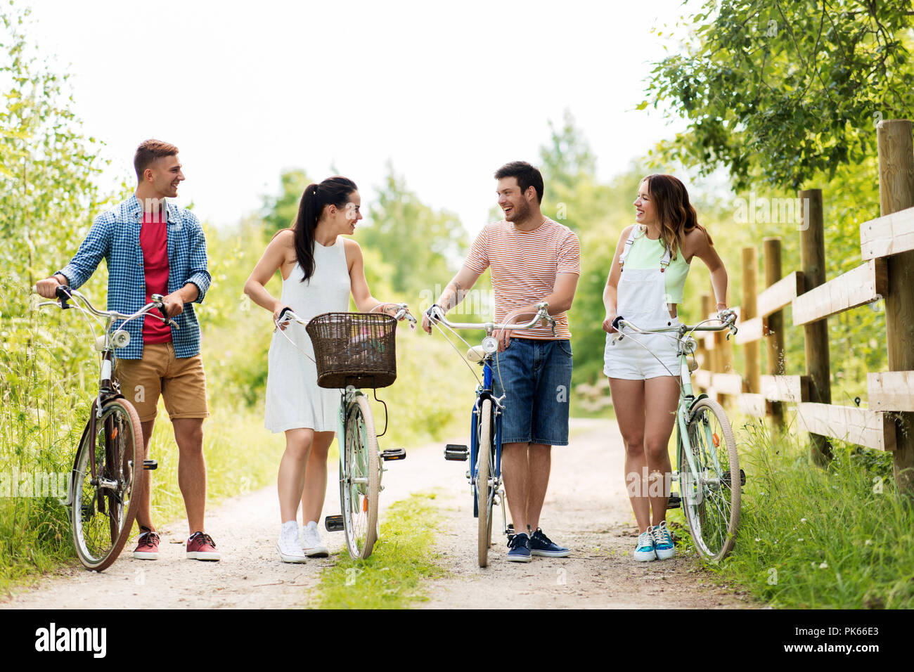 happy friends with fixed gear bicycles in summer Stock Photo - Alamy