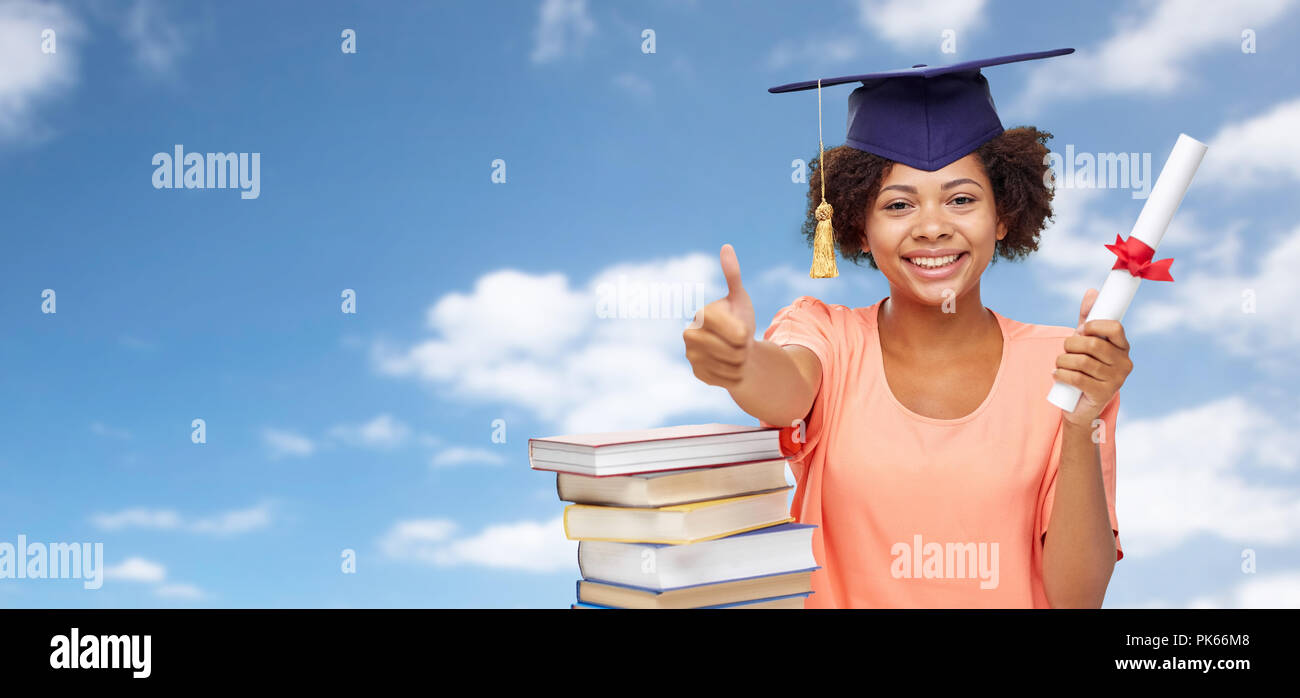 african graduate student with books and diploma Stock Photo - Alamy