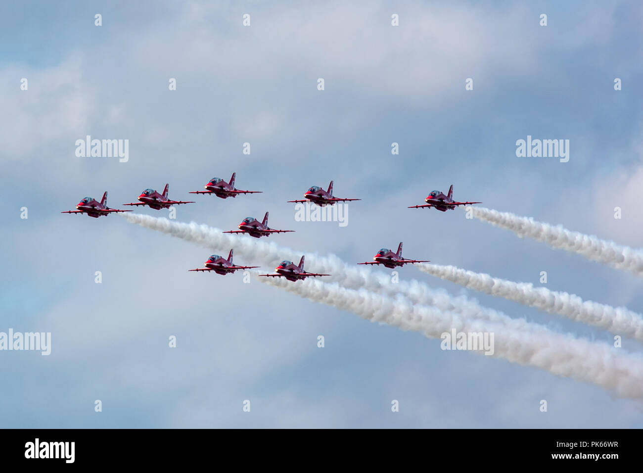 Nine RAF Red Arrows Hawk jets flying in formation Stock Photo - Alamy