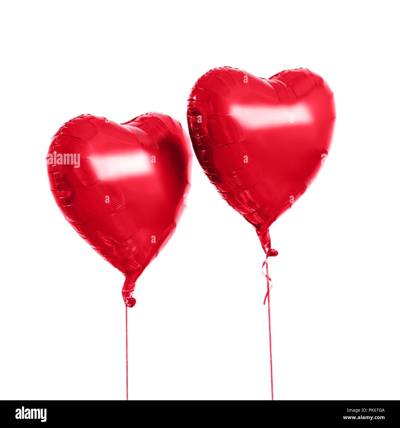 two red heart shaped helium balloons Stock Photo - Alamy