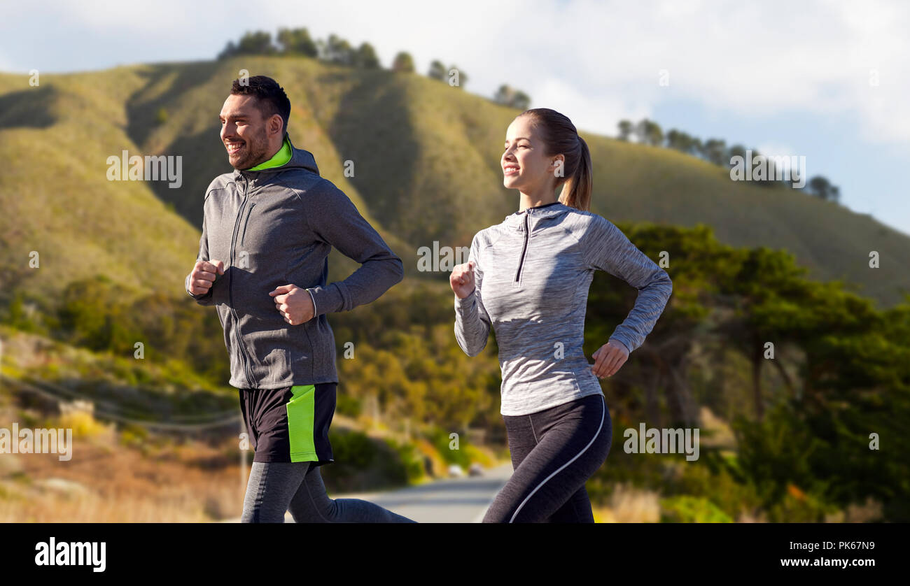 Man woman running hill hi-res stock photography and images - Alamy