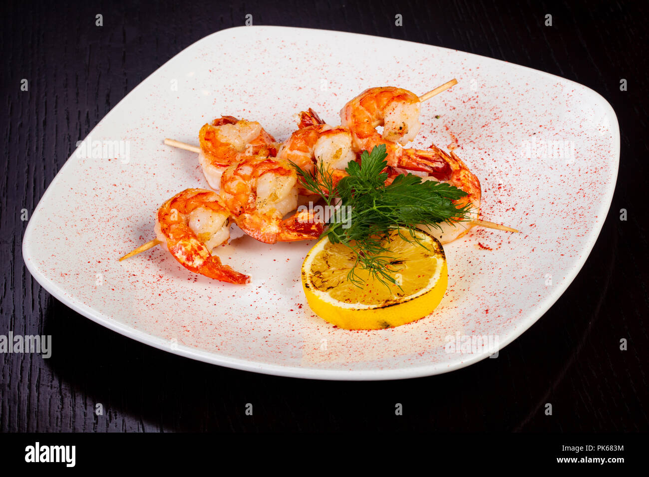 Tasty tiger prawn with garlic sauce Stock Photo - Alamy
