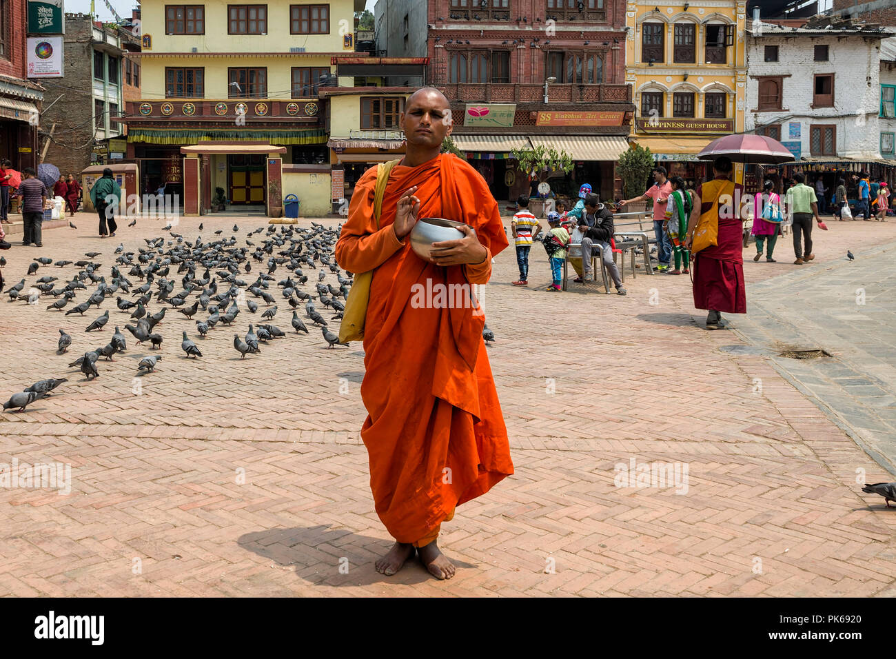 Kathmandu, Nepal - April 15, 2016: Unidentified monk with bowl standing ...