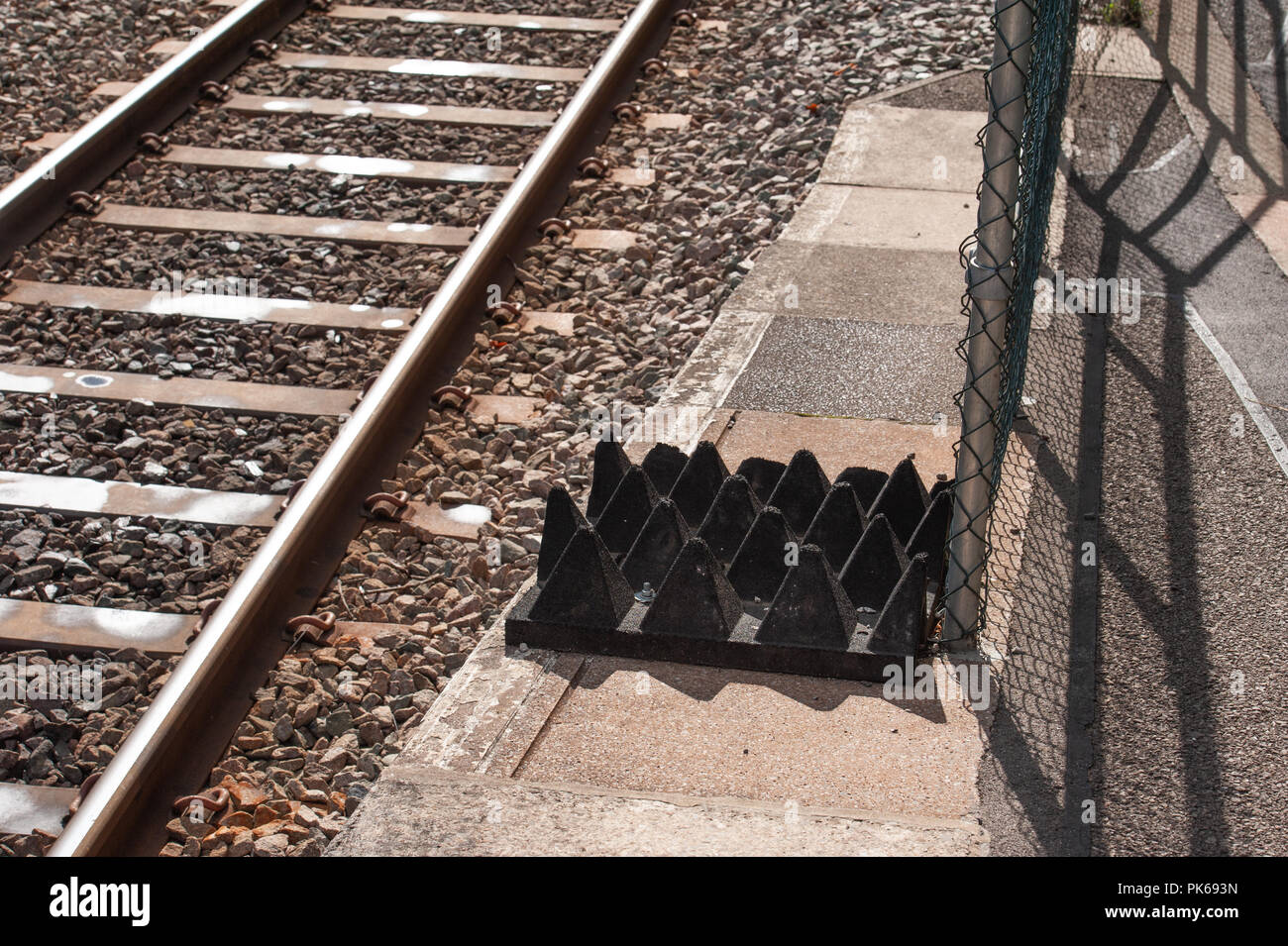 Trackside barrier to prevent wheeled access from station platform to ...