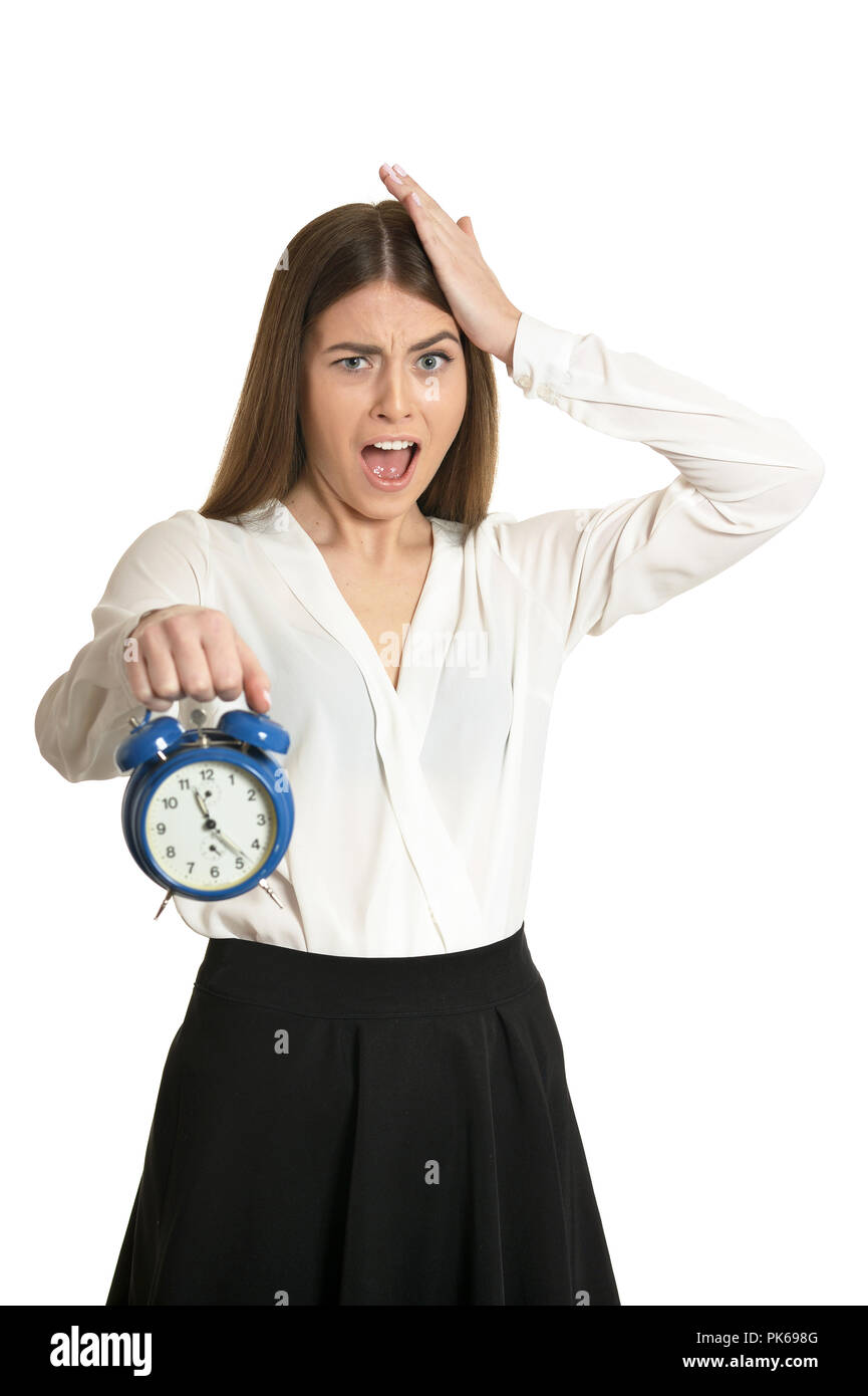 Young beautiful woman with the clock on white background Stock Photo ...