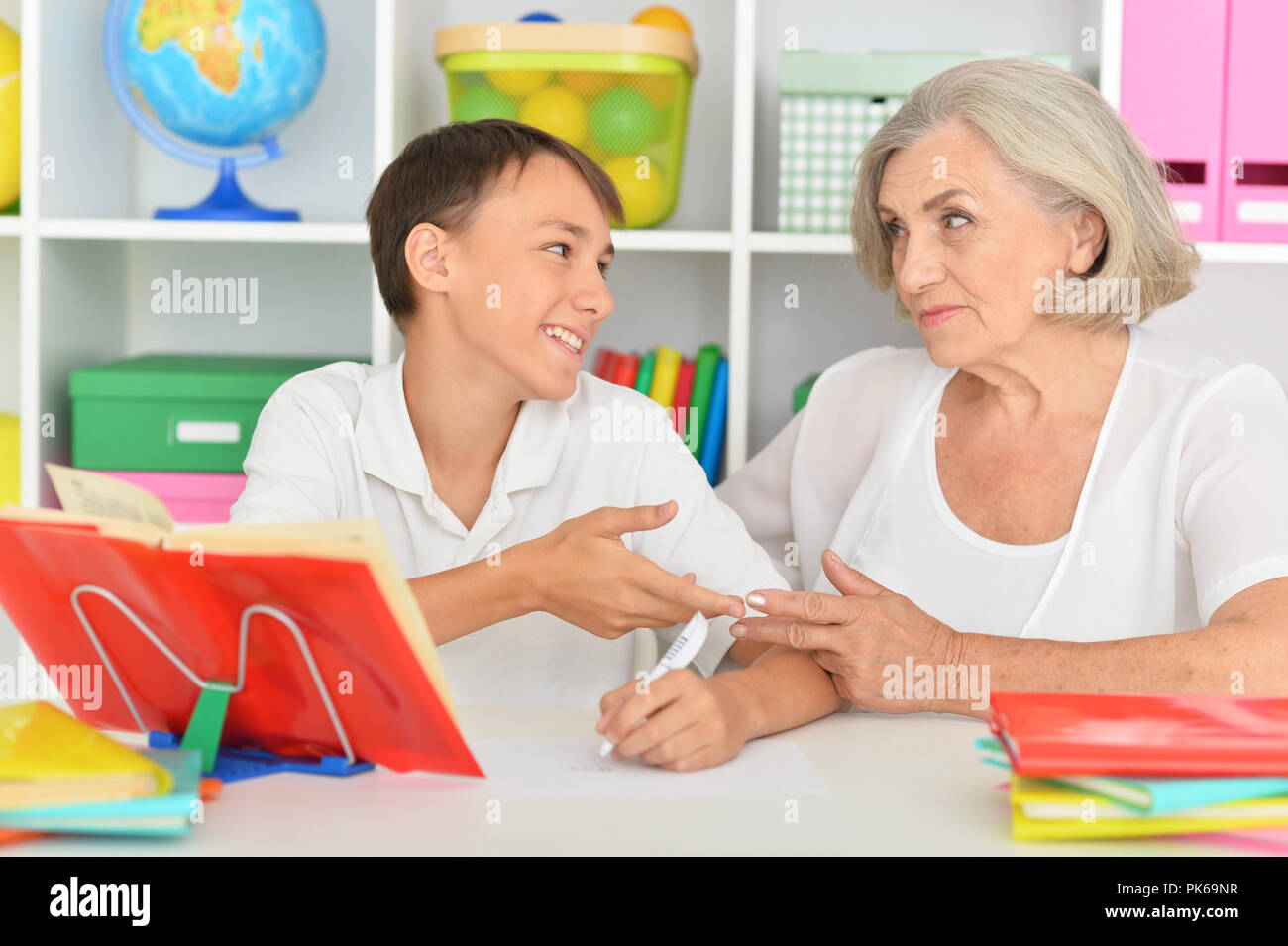 Portrait of schoolboy doing homework at home Stock Photo - Alamy