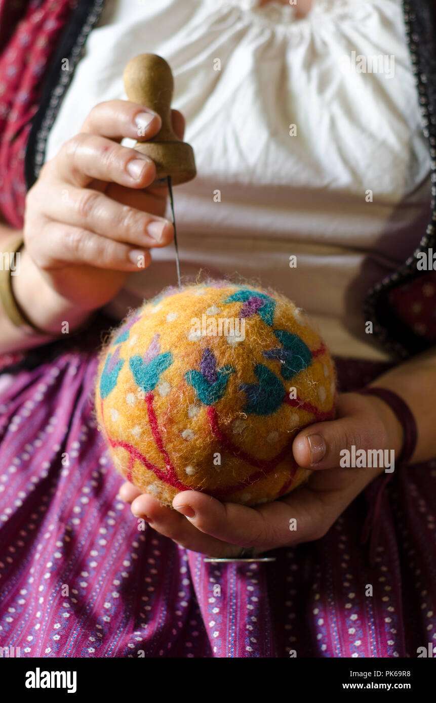 Process of felting. felted decoration made of wool with a traditional ...